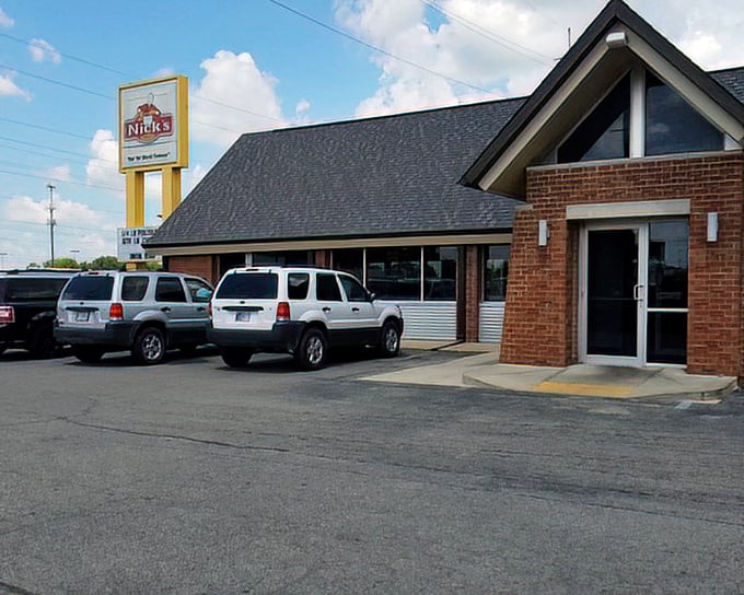 Nick's modest exterior hides decades of chili dog perfection waiting just beyond those brick walls.