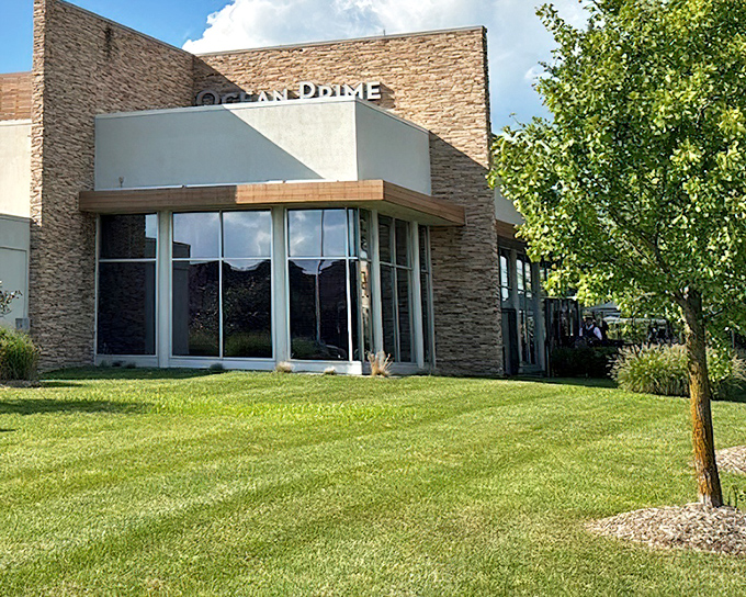 The sleek stone exterior of Ocean Prime hints at the elegant seafood experience waiting inside.
