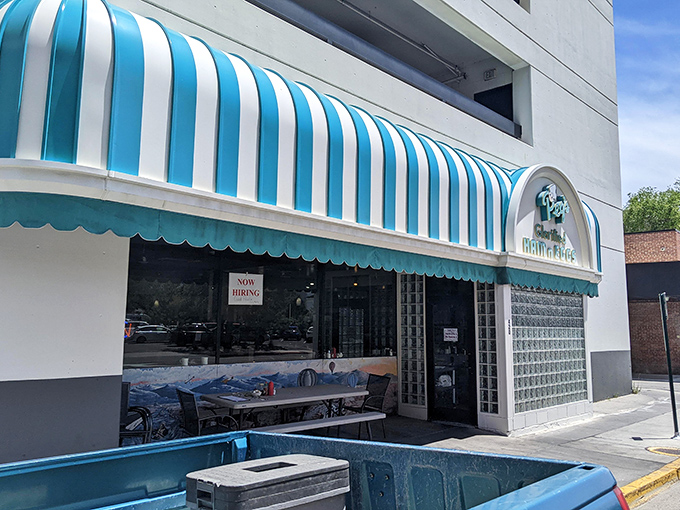 The cheerful striped canopy of Peg's promises glorified morning meals worth waiting for.