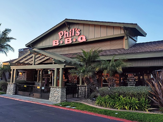 Phil&rsquo;s BBQ glows under the California sky, where palm trees, friendly vibes, and smoky aromas promise a true San Diego feast.