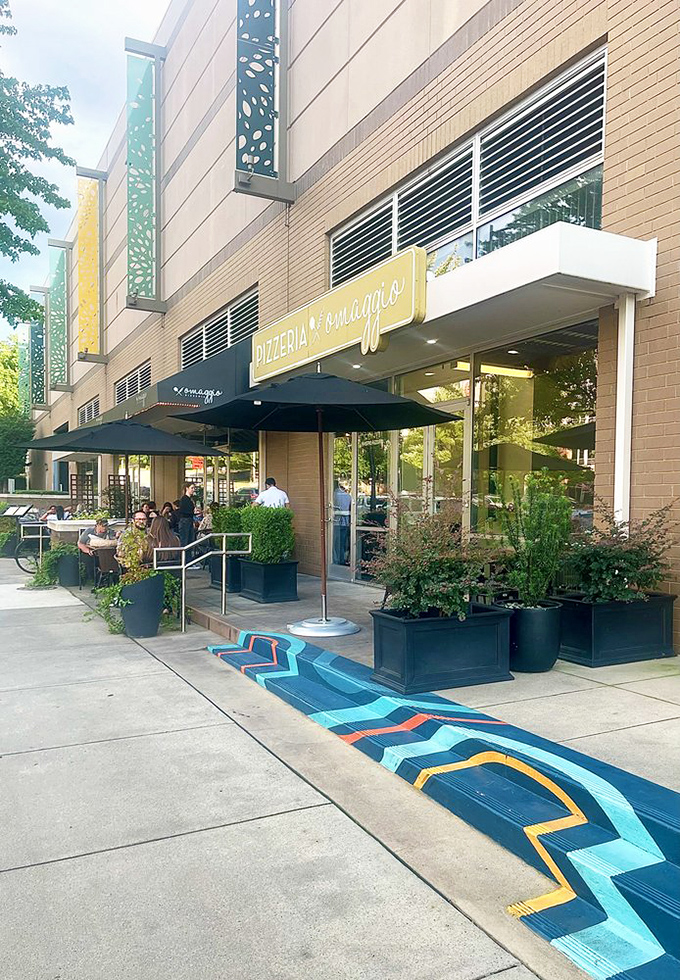 Pizzeria Omaggio's modern storefront promises a fresh take on traditional flavors. Sophistication meets simplicity.