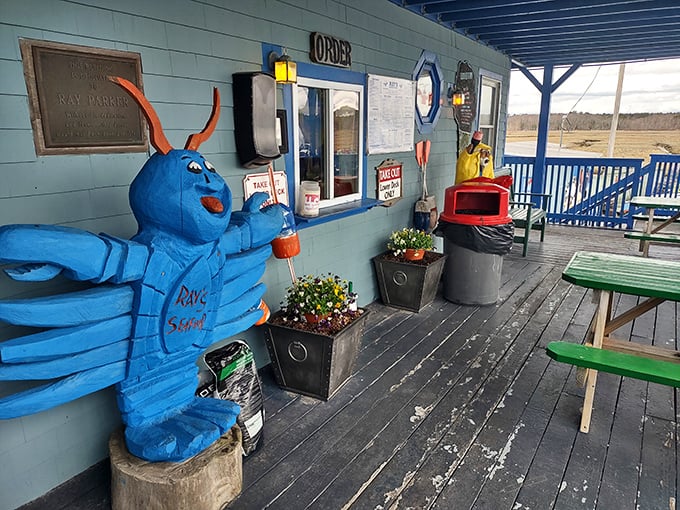 That blue lobster mascot stands guard outside Ray's &ndash; a whimsical sentinel protecting serious seafood within.