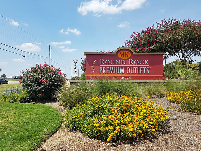 Those cheerful yellow flowers bloom like little bursts of sunshine, welcoming shoppers to this Austin-area bargain paradise.