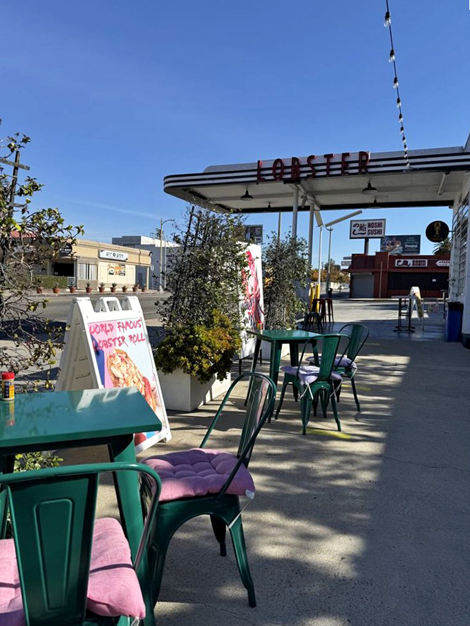 The retro charm of Royal Lobster LA's converted gas station creates the perfect urban seafood oasis. String lights add just the right touch.