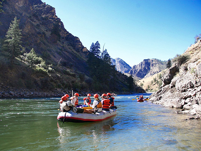 Adventure awaits on the Salmon River, where rafters navigate thrilling rapids through a stunning mountain corridor.