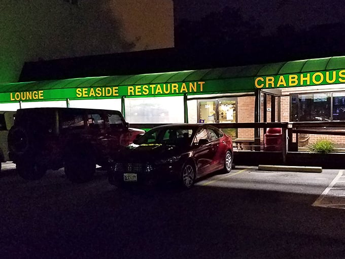 Night falls but Seaside's sign shines bright. Like a bat signal for those with crab cravings.