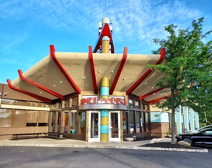 The Skylark's swooping roof and bright colors promise breakfast with personality. Pancakes taste better when served with architectural flair.
