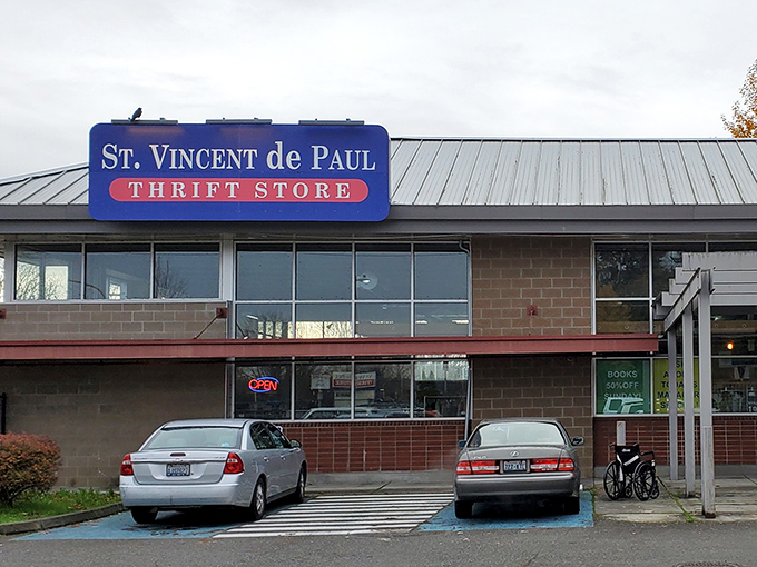The blue signage of this Renton thrift store stands out against gray Washington skies, beckoning bargain seekers inside.