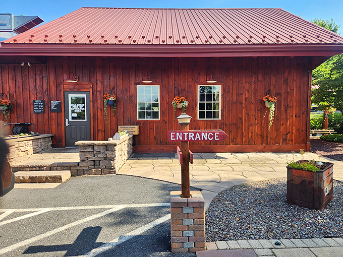 The warm wooden building with its cheerful red roof promises comfort food that lives up to the inviting atmosphere.