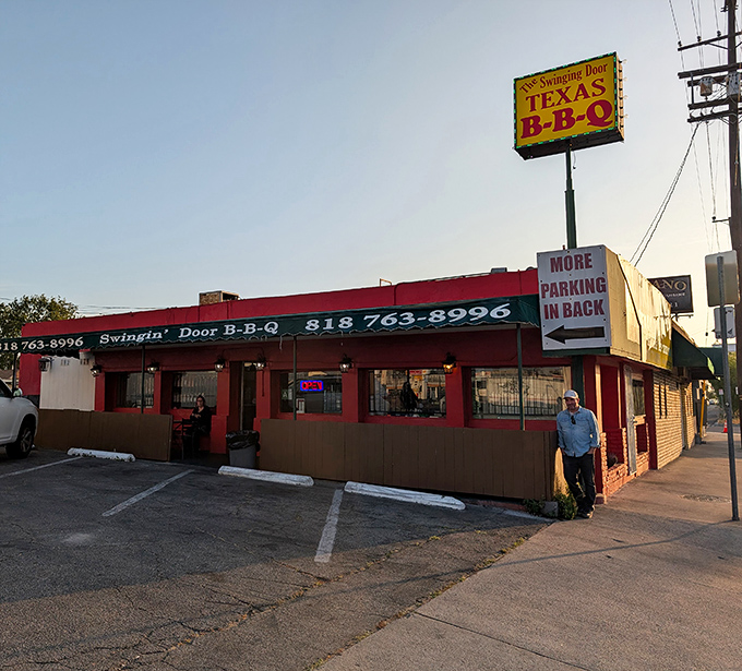 Texas pride in the Valley! Swinging Door's distinctive red building and bold signage promises authentic Lone Star State flavors in SoCal.