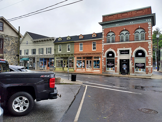 These perfectly preserved storefronts create a postcard-perfect scene where every building has its own delightful personality.