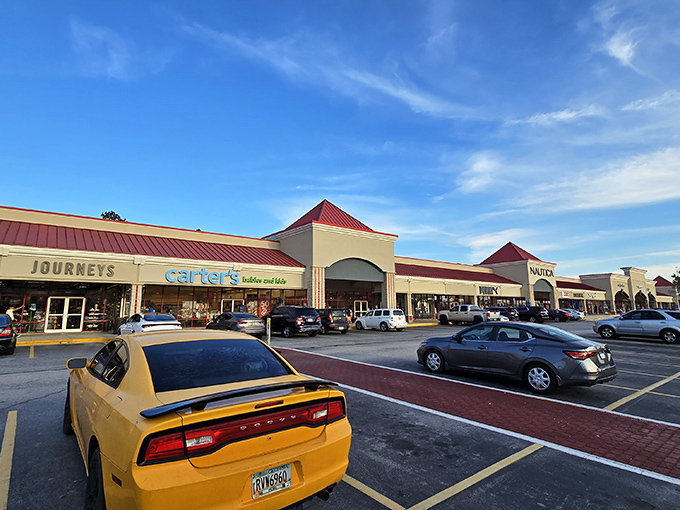 That bright yellow Dodge Charger knows exactly where the best deals are hiding in this Georgia outlet paradise.