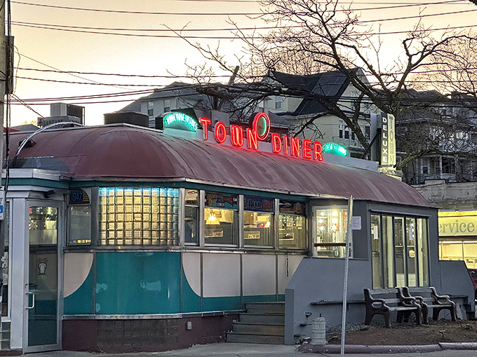 The Deluxe Town Diner glows like a spaceship, ready to transport you to breakfast heaven.