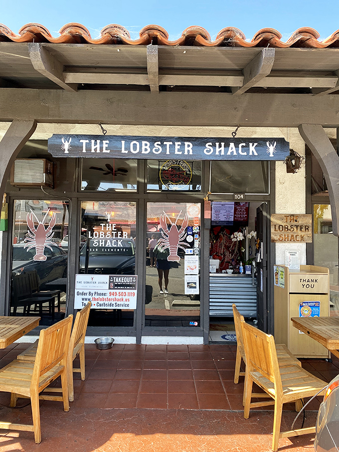 Those weathered wooden beams and cozy patio seating create the perfect backdrop for serious lobster roll contemplation.