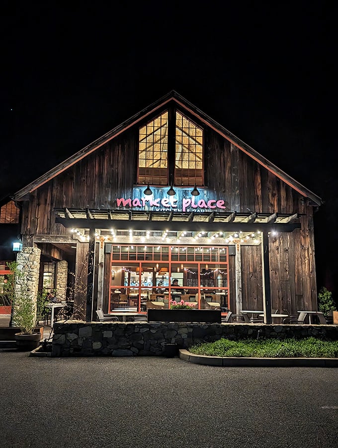The Marketplace glows like a lantern at night, beckoning hungry travelers to its warm, wood-lined interior.