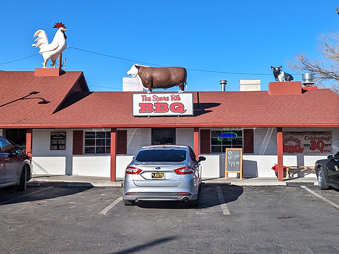 The Spare Rib's simple white building with red trim houses BBQ magic. That rooster seems pretty proud of what's cooking below.