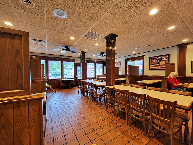 Wood paneling and American flags create the perfect backdrop for multigenerational family pizza nights together.