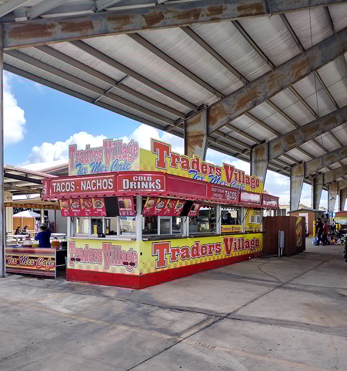 The 77 Flea Market entrance stands as a no-frills gateway to bargain hunting adventures along the Texas border.
