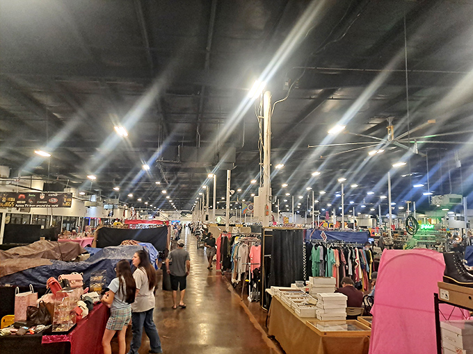 Endless aisles stretch like highways to happiness where every booth offers new discoveries waiting.