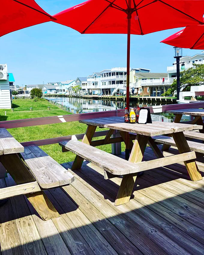 Red umbrellas and waterfront views create the perfect recipe for relaxation and good eats.