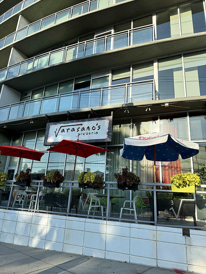 Those umbrellas and modern lines hint at the refined pizza experience waiting inside Varasano's. 