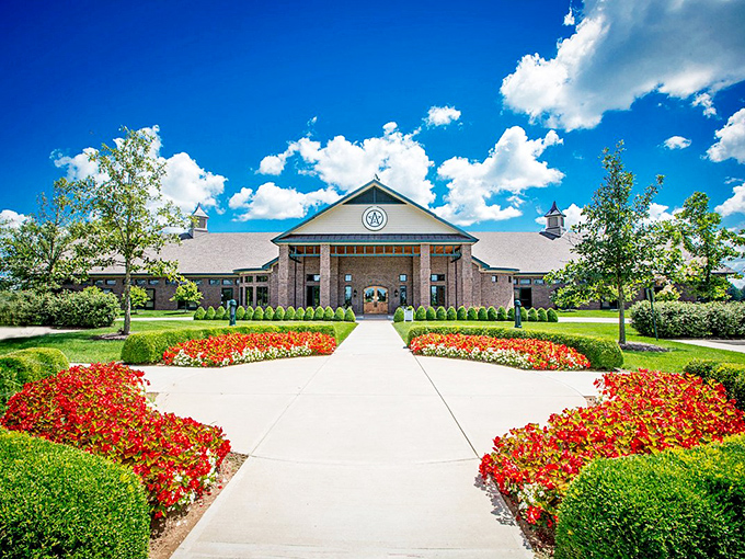 This elegant building in Versailles welcomes visitors with manicured grounds and flowers that seem to say, "Come on in, y'all!"