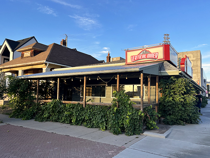 Lush greenery frames the Vertical Diner's entrance &ndash; nature's way of endorsing their plant-based comfort food revolution.