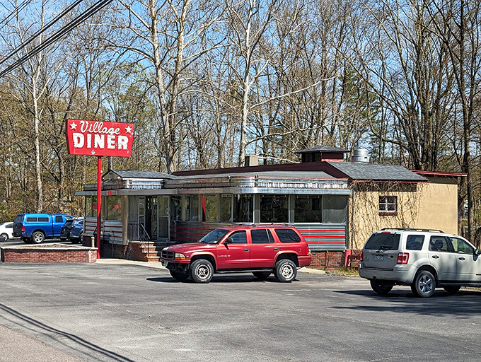 Classic red signage beckons hungry souls to discover what real diner hospitality tastes like.