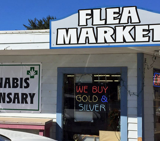 That classic "Flea Market" sign beckons like a lighthouse for bargain hunters along Highway 101.