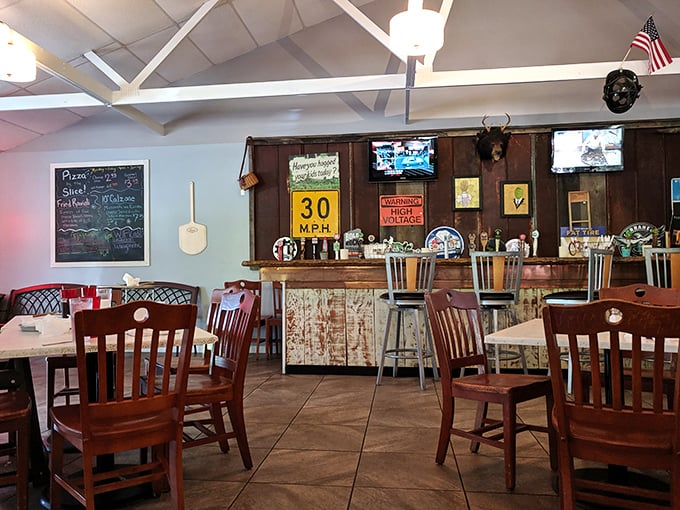 Where pizza meets mountain hospitality. Inside this cozy red building, trophy buck mounts watch approvingly as you devour your pie.