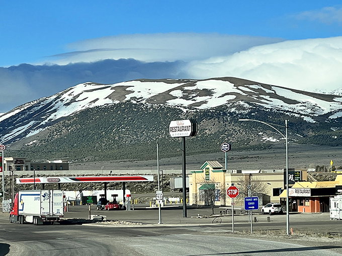 Snow-capped peaks frame Wells, Nevada, where roadside diners, friendly stops, and open skies make every drive feel refreshing.
