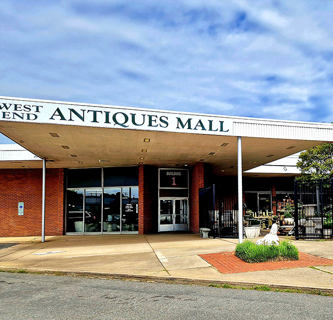 The classic brick fa&ccedil;ade of West End Antiques Mall stands sentinel over decades of collectibles. History waits inside those doors.