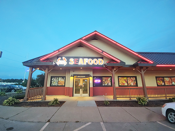 As dusk falls, the red-trimmed roofline glows like embers - much like the cajun spices waiting inside.