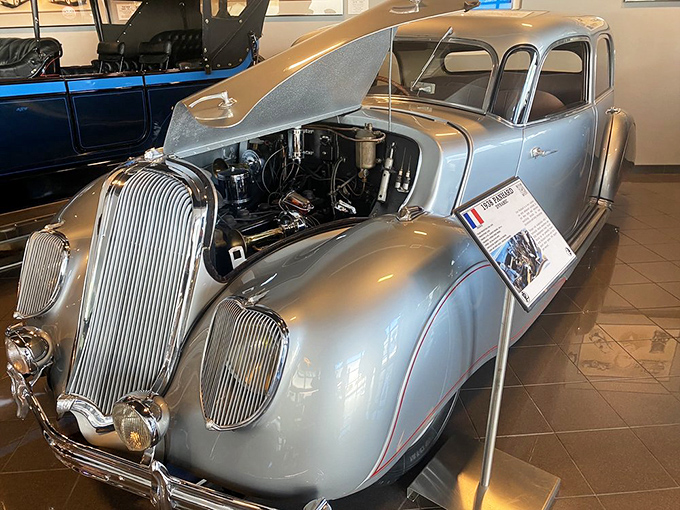 Streamlined like a silver bullet, this 1938 Panhard demonstrates when cars began embracing aerodynamics. The hood opens to reveal its mechanical heart.