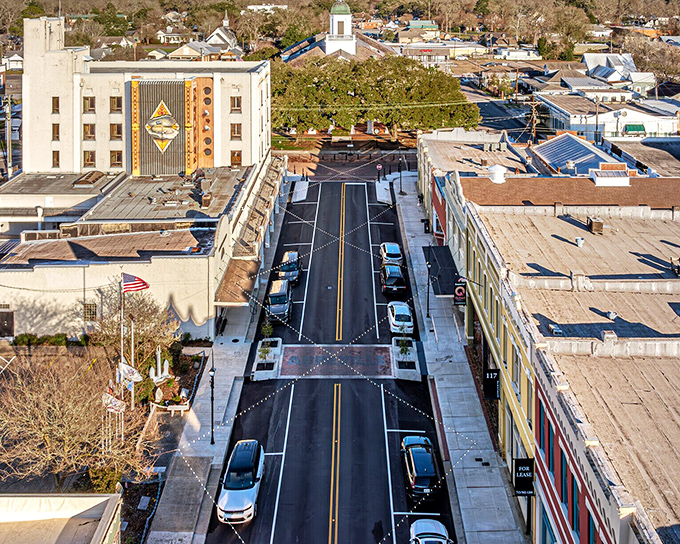 The aerial view of Abbeville's main street showcases the careful preservation that makes this town feel like stepping into a different era.