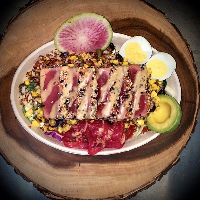 Seared ahi tuna, pink as a sunset, resting on a vibrant bed of grains and vegetables&mdash;proof that Jolly Rogers isn't just about the fryer.