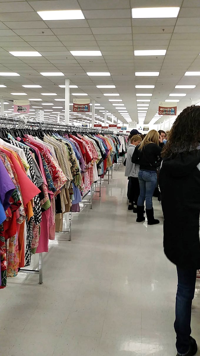 Shoppers with their distinctive red carts navigate the well-lit aisles, each turn revealing new possibilities for home, wardrobe, and beyond.