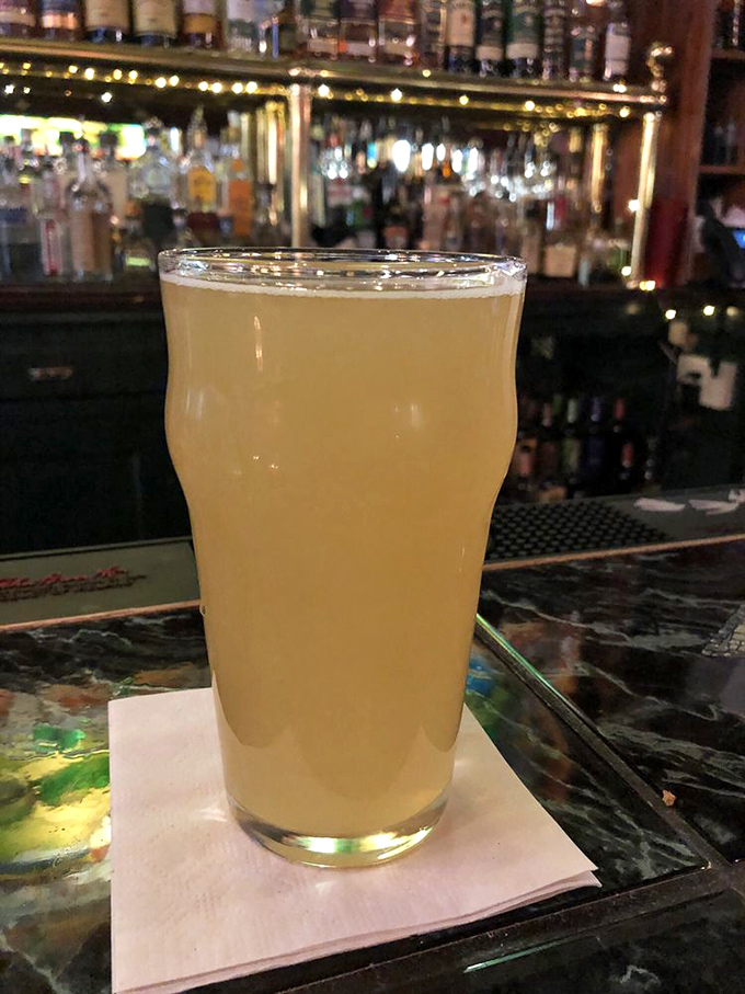 A perfectly poured pint of something golden and hazy – like liquid sunshine waiting to brighten your afternoon in downtown Harrisburg.