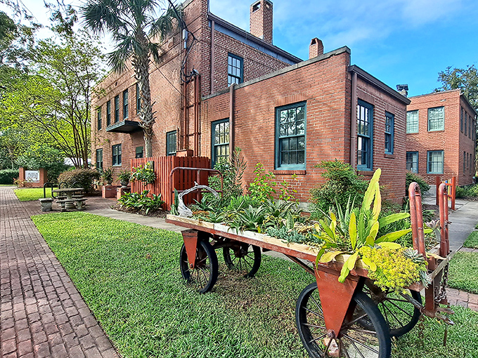 The Amelia Island Museum of History proves that brick buildings and lush gardens make perfect companions. That vintage wheelbarrow isn't just decorative&mdash;it's transported generations of stories.