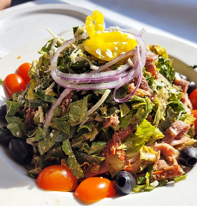 The antipasto salad brings together cured meats, cheeses, olives, and crisp vegetables in a harmony that makes you wonder why salads ever got a boring reputation.