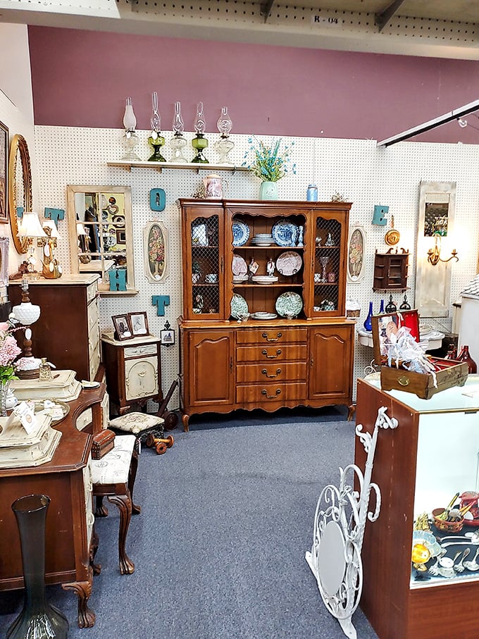 Elegant furniture arranged like a period film set. That hutch has probably witnessed more family dinners than most of us ever will.