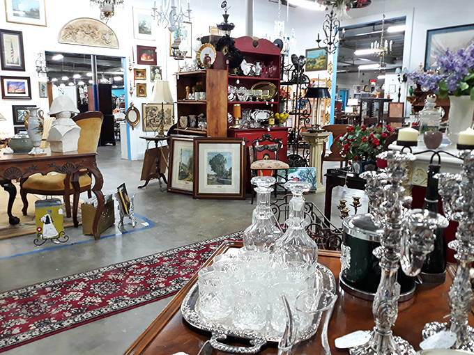 Crystal decanters and silver serving pieces stand ready, as though expecting Gatsby himself to host a soirée at any moment.