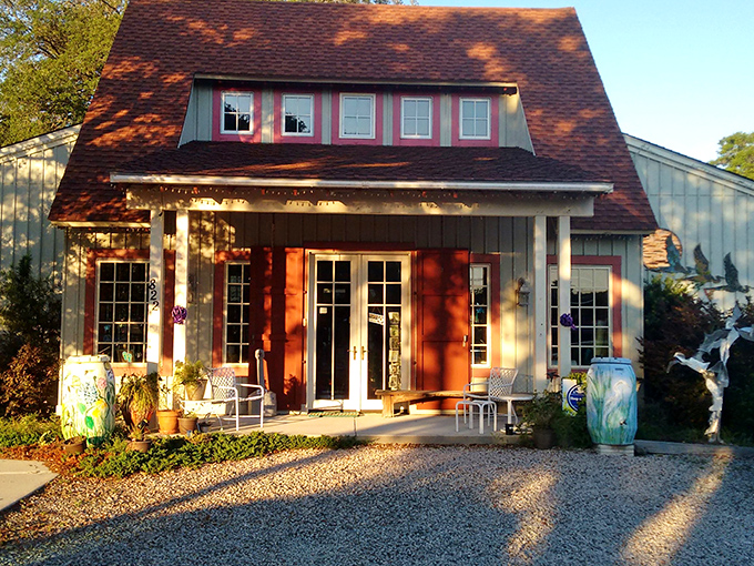 Artshak Studio glows in golden hour light like a treasure chest of creativity. Those oversized pottery pieces standing guard outside hint at the artistic wonders within.