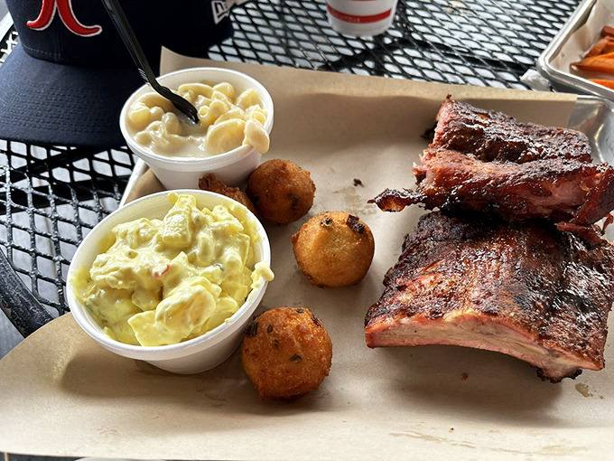 Ribs, mac and cheese, potato salad, and hush puppies &ndash; the Mount Rushmore of Southern BBQ, carved with smoke and patience.