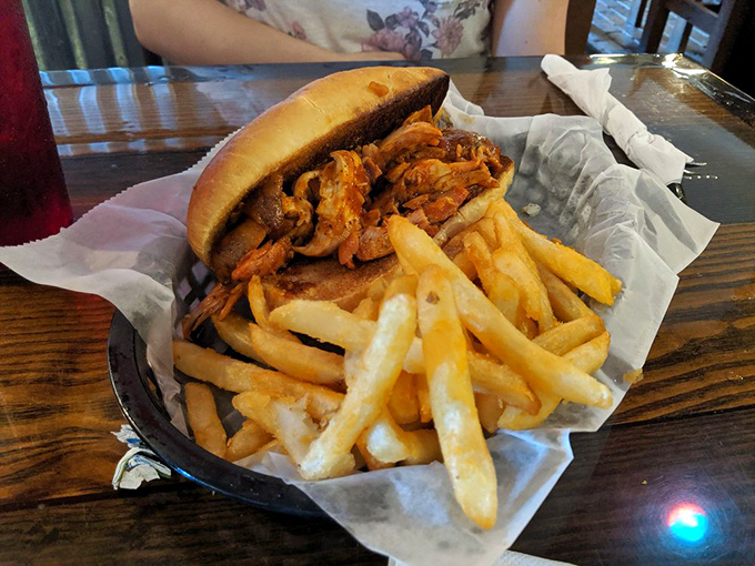 This pulled pork sandwich isn't messing around&mdash;piled high with tender, smoke-kissed meat and paired with hand-cut fries that could steal the show themselves.