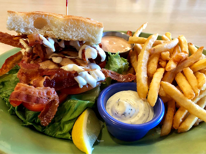 Bacon, lettuce, tomato, and probably the best decision you'll make today &ndash; served with fries that vanish mysteriously fast.