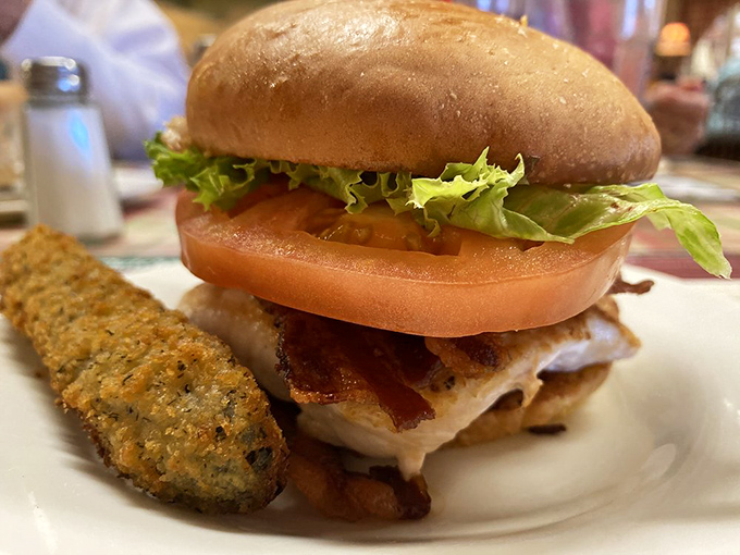 A sandwich that understands the importance of proper architecture—crisp lettuce, juicy tomato, and bacon creating the perfect foundation for tender chicken.