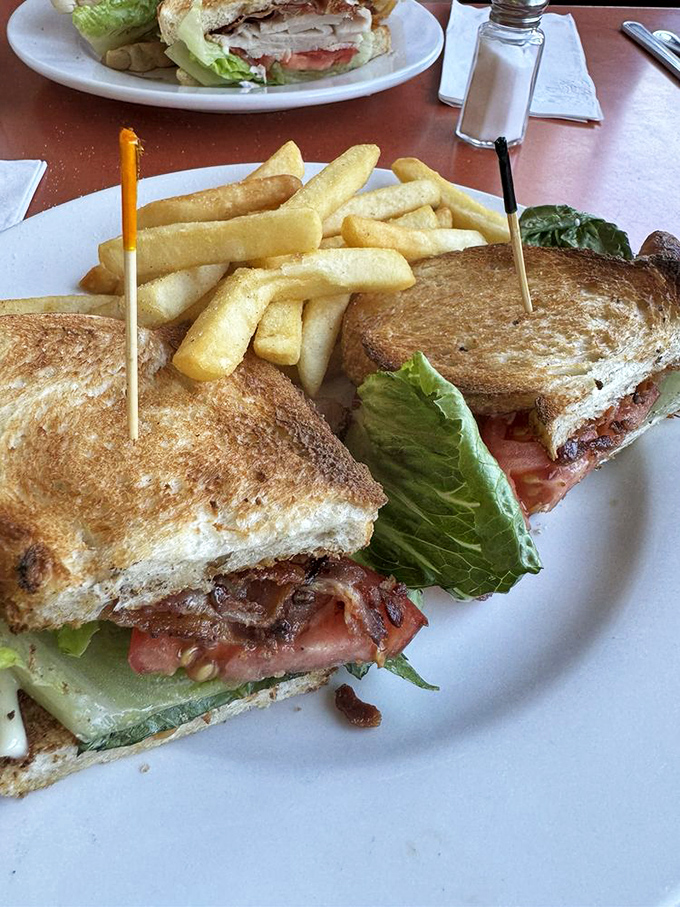 The BLT&mdash;a sandwich so perfect it needs only three letters to identify it. Those golden fries are the supporting actors in this culinary show.