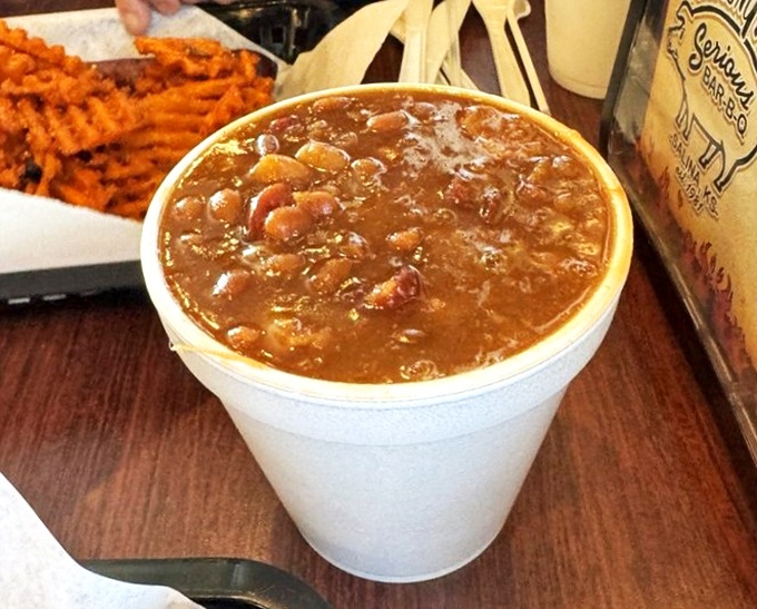 These baked beans have clearly been simmering long enough to achieve that perfect sweet-savory balance that makes you forget they're technically vegetables.