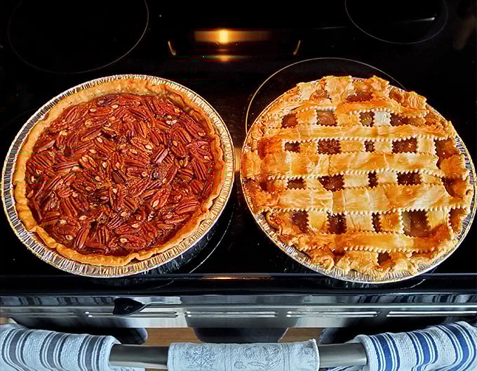 Pecan pie and apple pie sitting side by side like old friends &ndash; the sweet, sticky Southern classic alongside America's favorite, both begging for a scoop of vanilla.